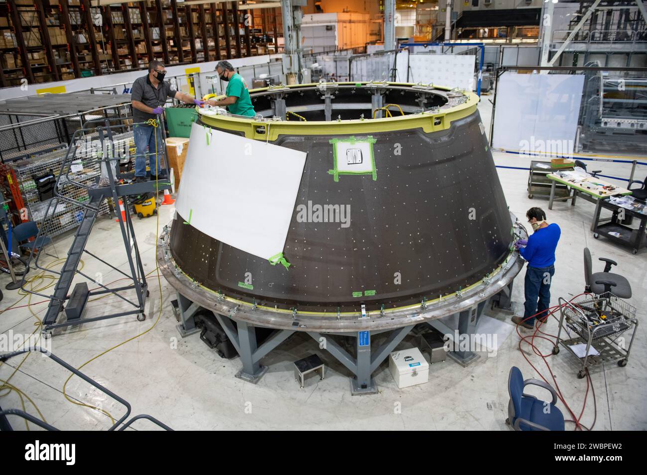 Employees wear personal protective gear at Michoud Assembly Facility as ...