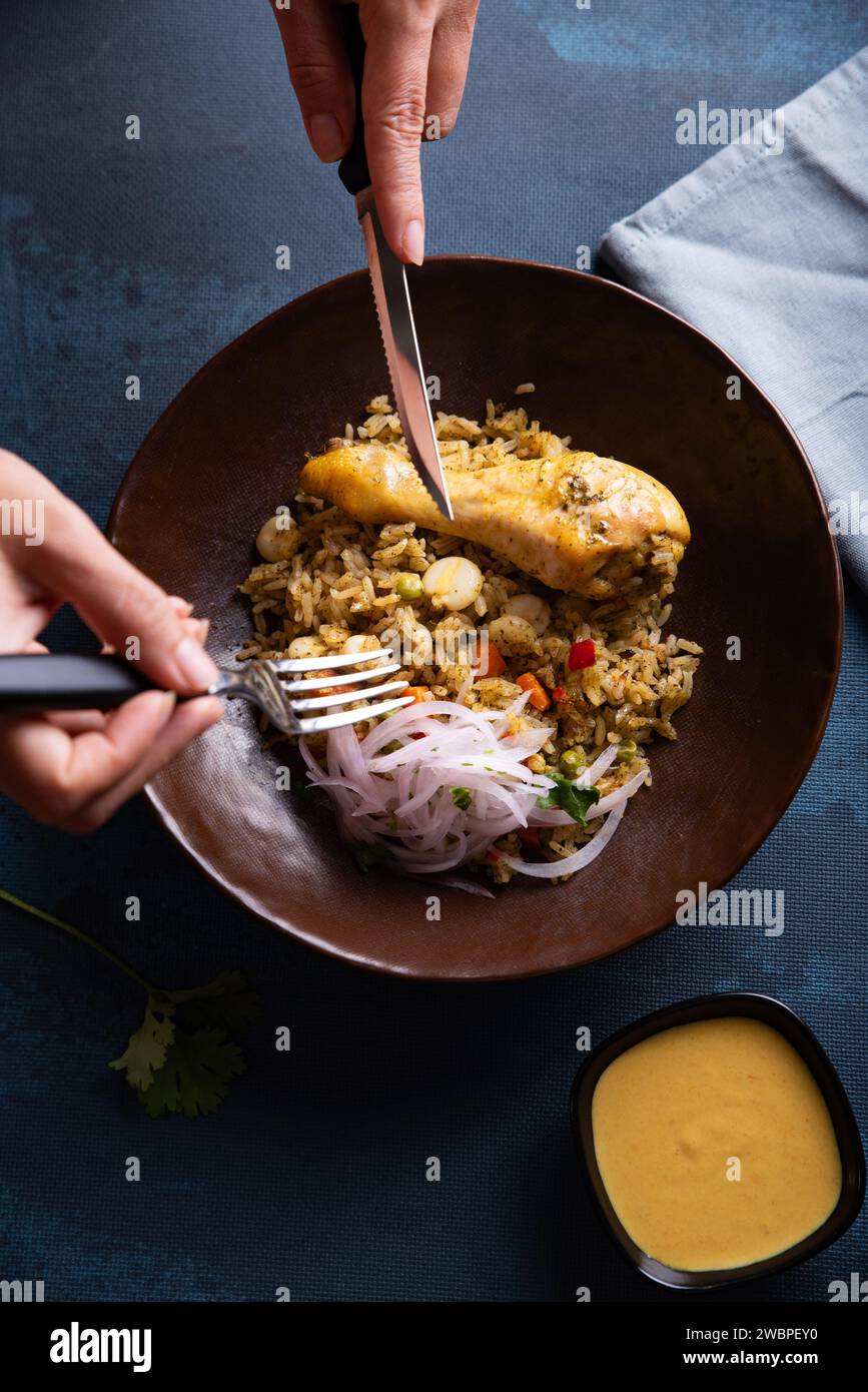Seen from above, traditional Peruvian dish called Arroz con pollo very ...