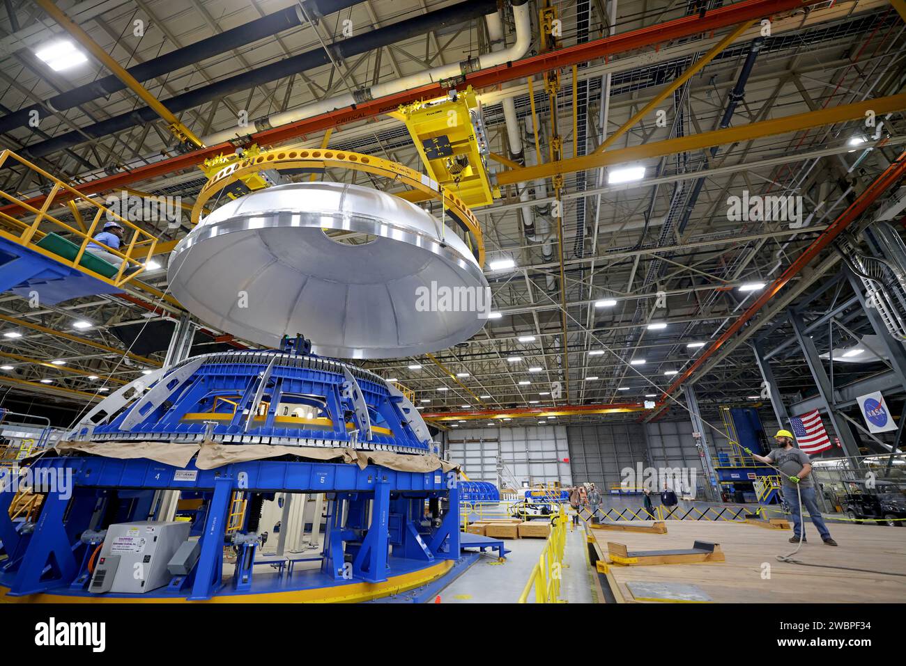 This imagery shows how technicians at NASA’s Michoud Assembly Facility moved the aft dome of the ...
