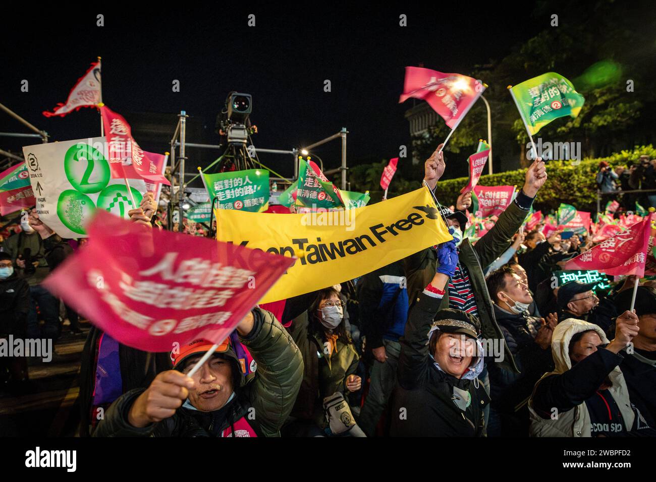 Taiwan, Jan 11, 2024. Supporters were waving a banner written “Keep ...