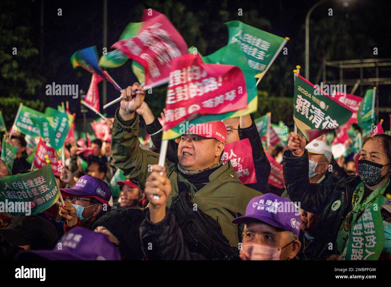 Taiwan, Jan 11, 2024. A supporter was waving his flags to show his ...