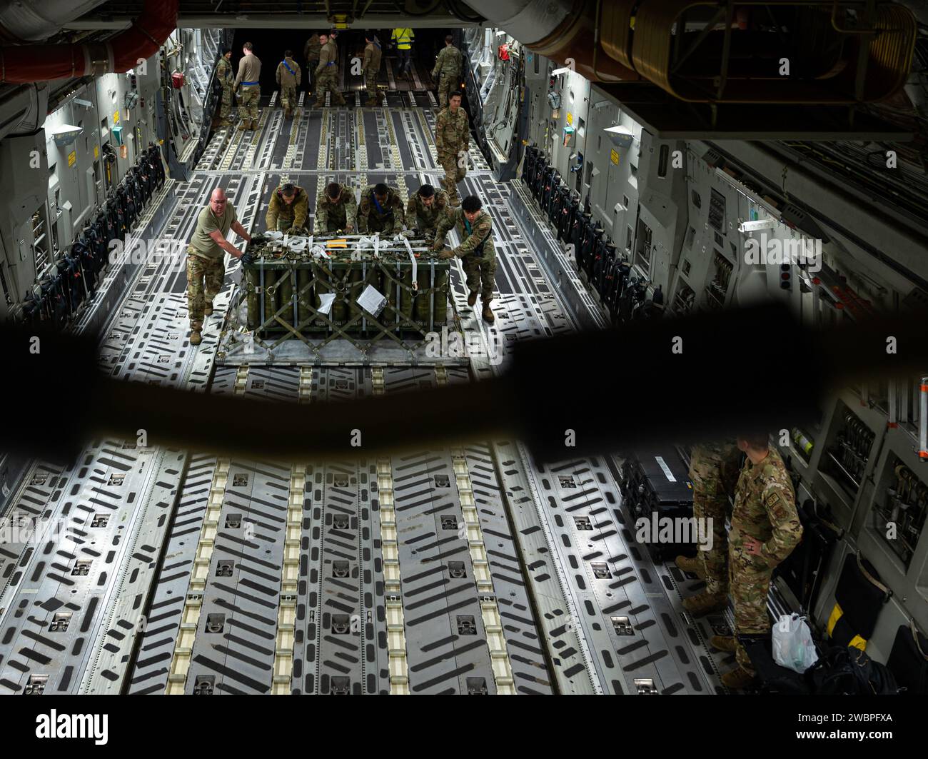 U.S. Air Force Airmen assigned to Ramstein Air Base, Germany, load ...