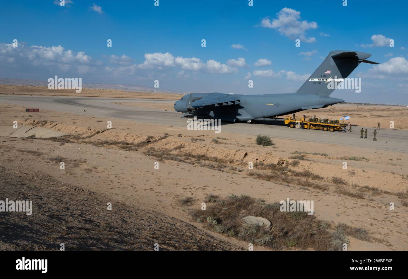 U.S. Air Force Airmen assigned to Ramstein Air Base, Germany, hand off ...