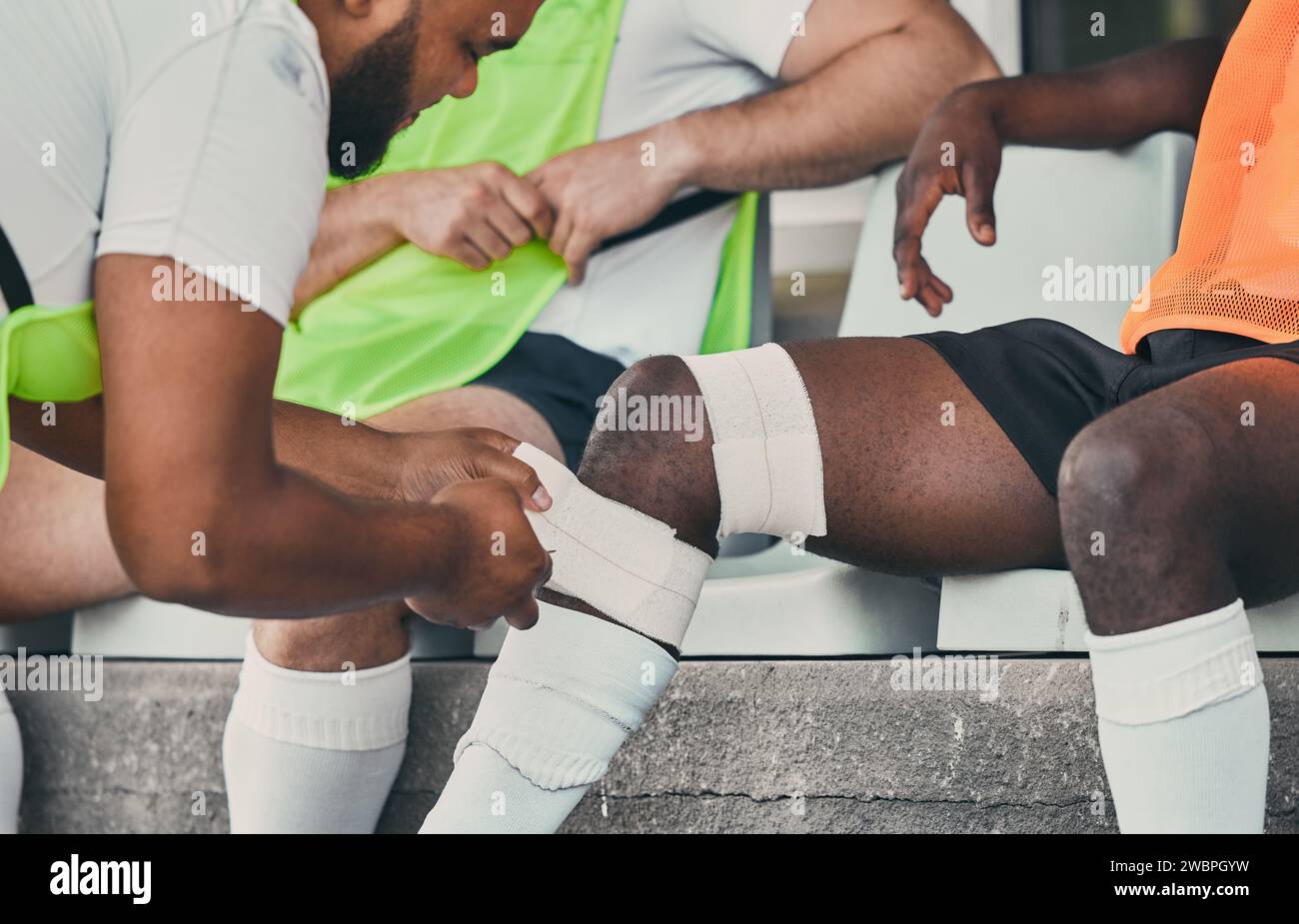Bandage, legs injury and man with medic after practice match, training ...