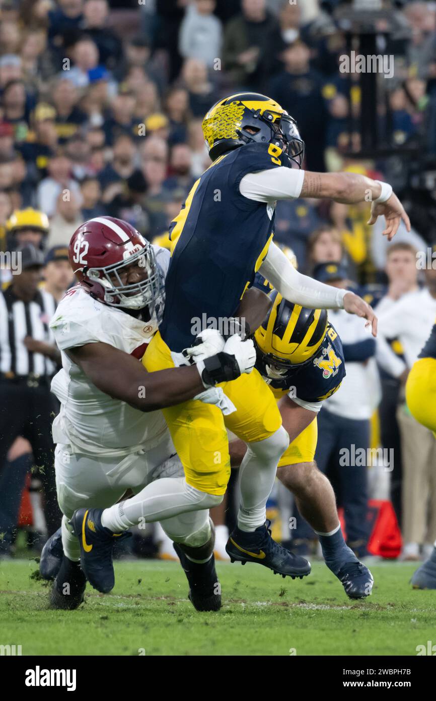Pasadena, USA. 01st Jan, 2024. Michigan Wolverines quarterback J.J. McCarthy (9) is hurried by ...