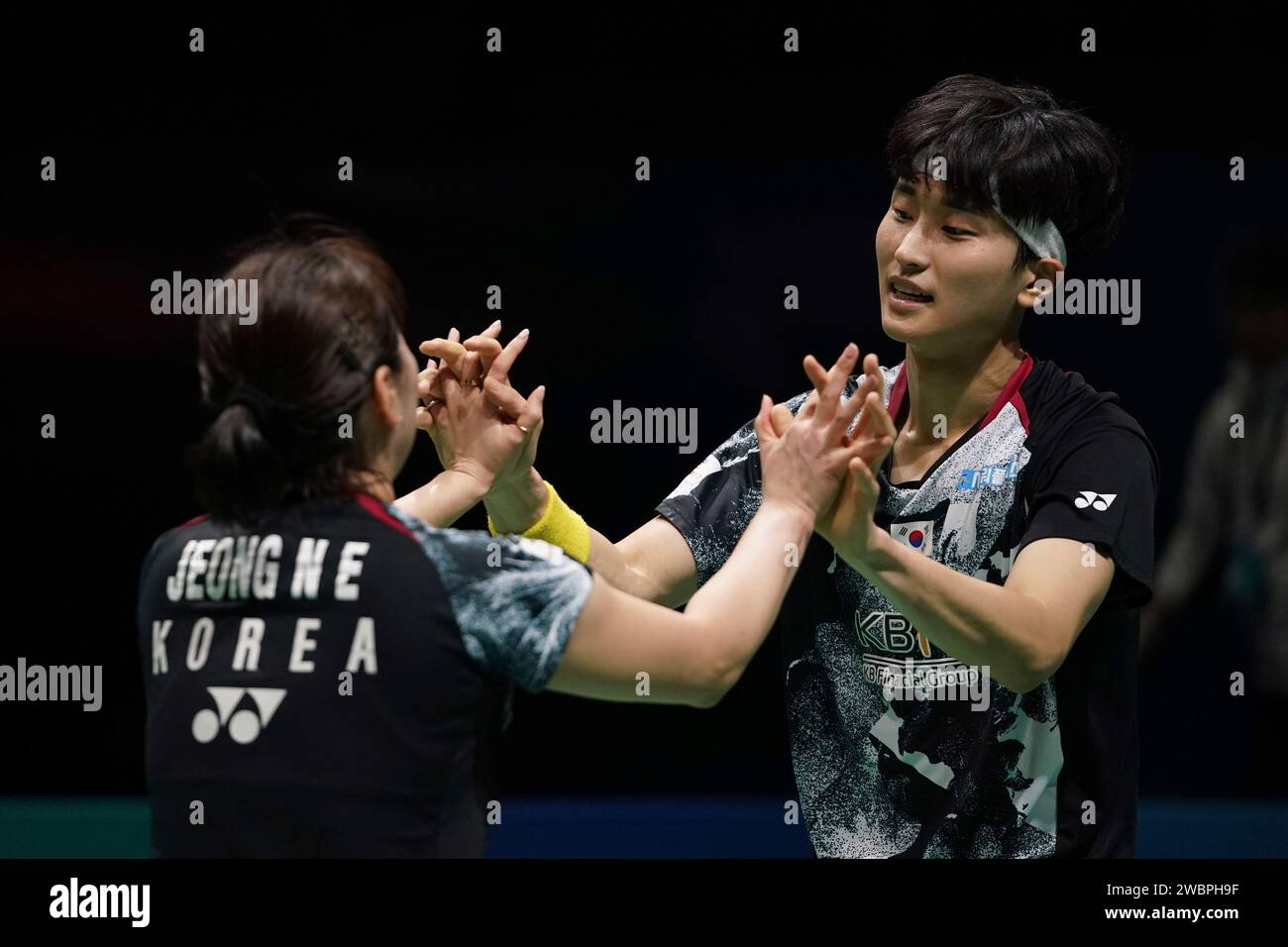 South Korea's Kim Won Ho, right, and Jeong Na Eun celebrate after defeating China's Zheng Si Wei ...
