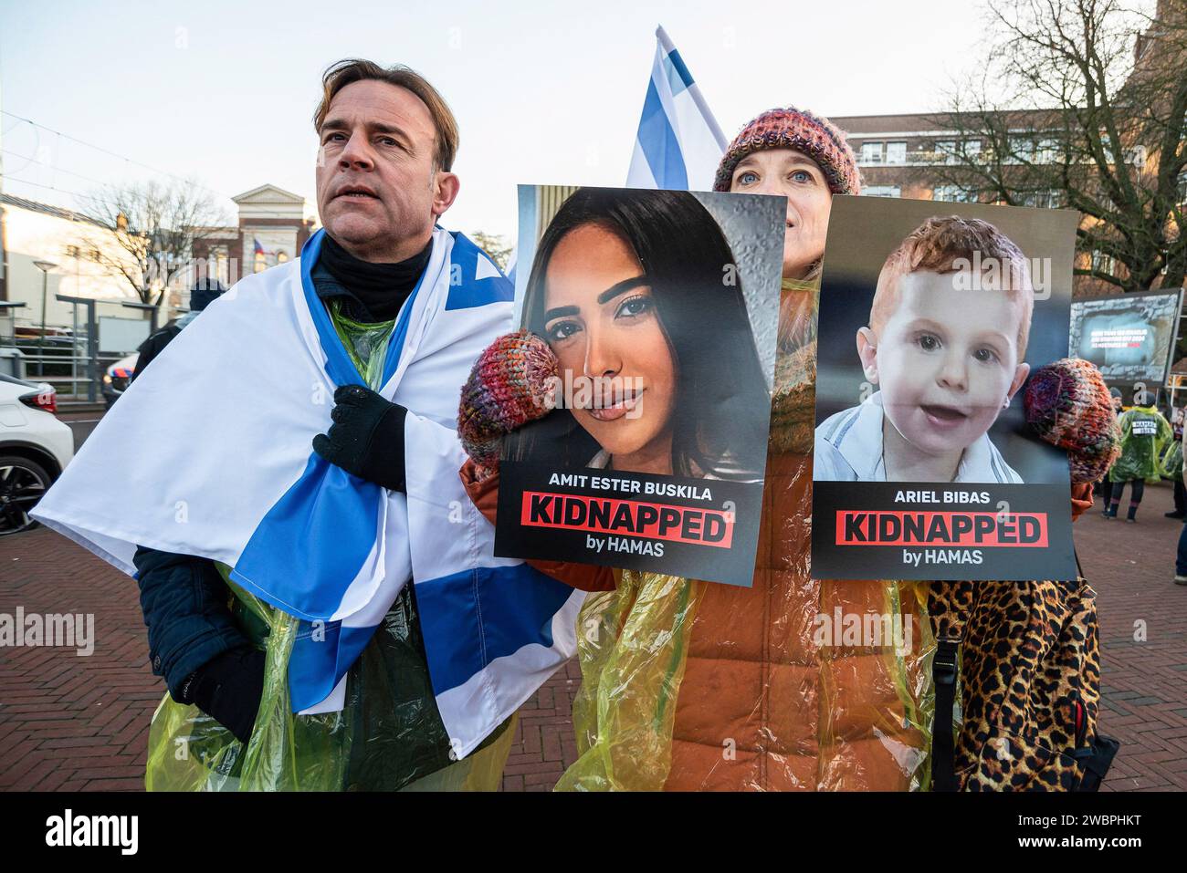 Israeli supporters hold pictures of kidnapped victims held by Hama ...