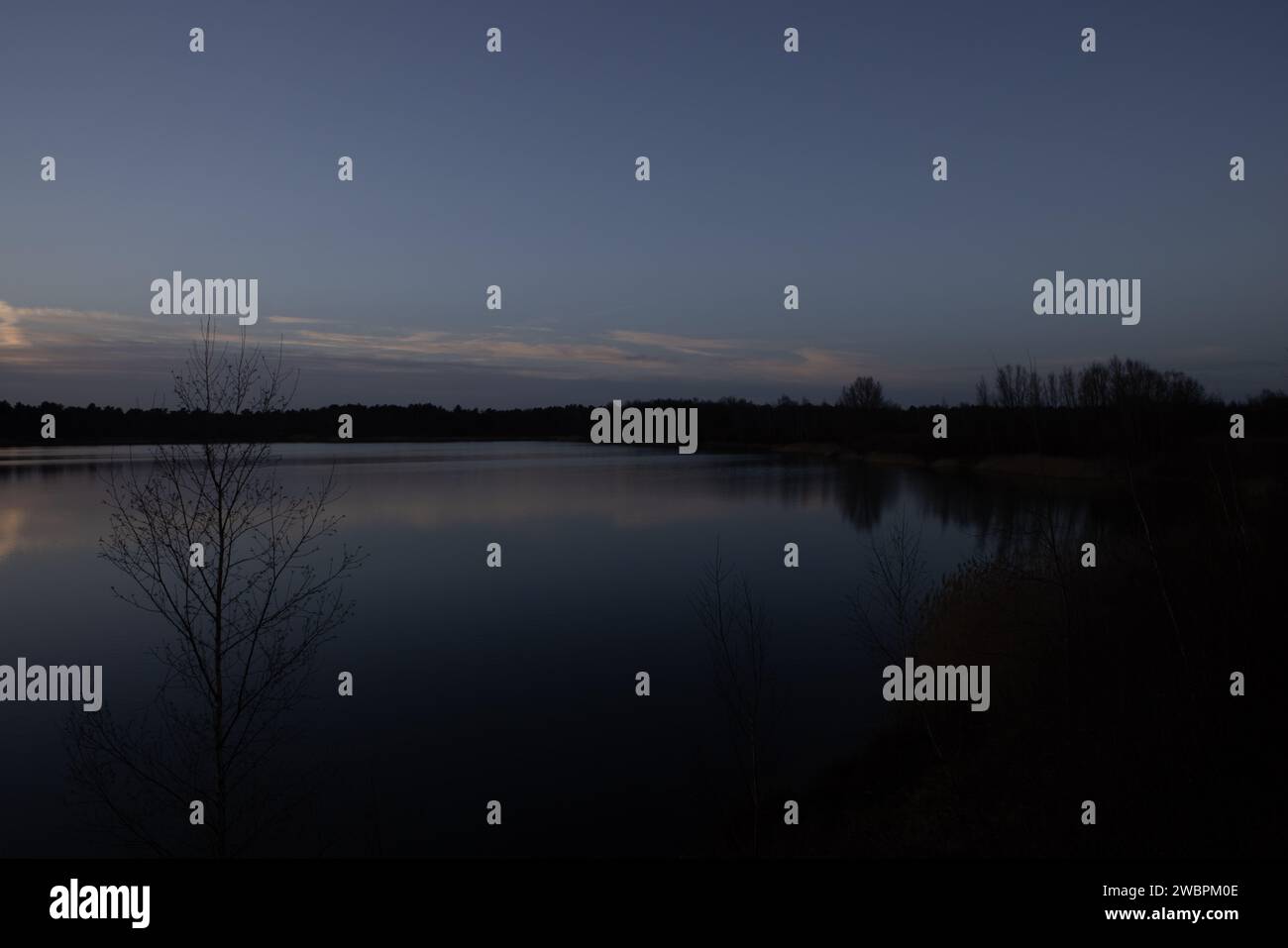 In this image, the quietude of early evening is palpable as the day's ...