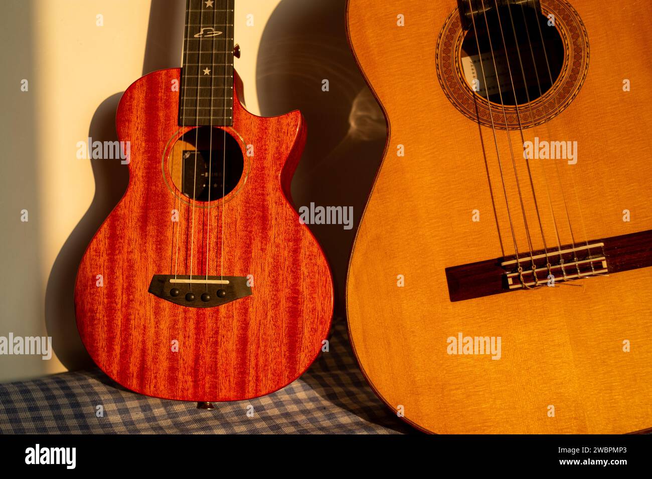 A guitar and a ukulele Stock Photo - Alamy