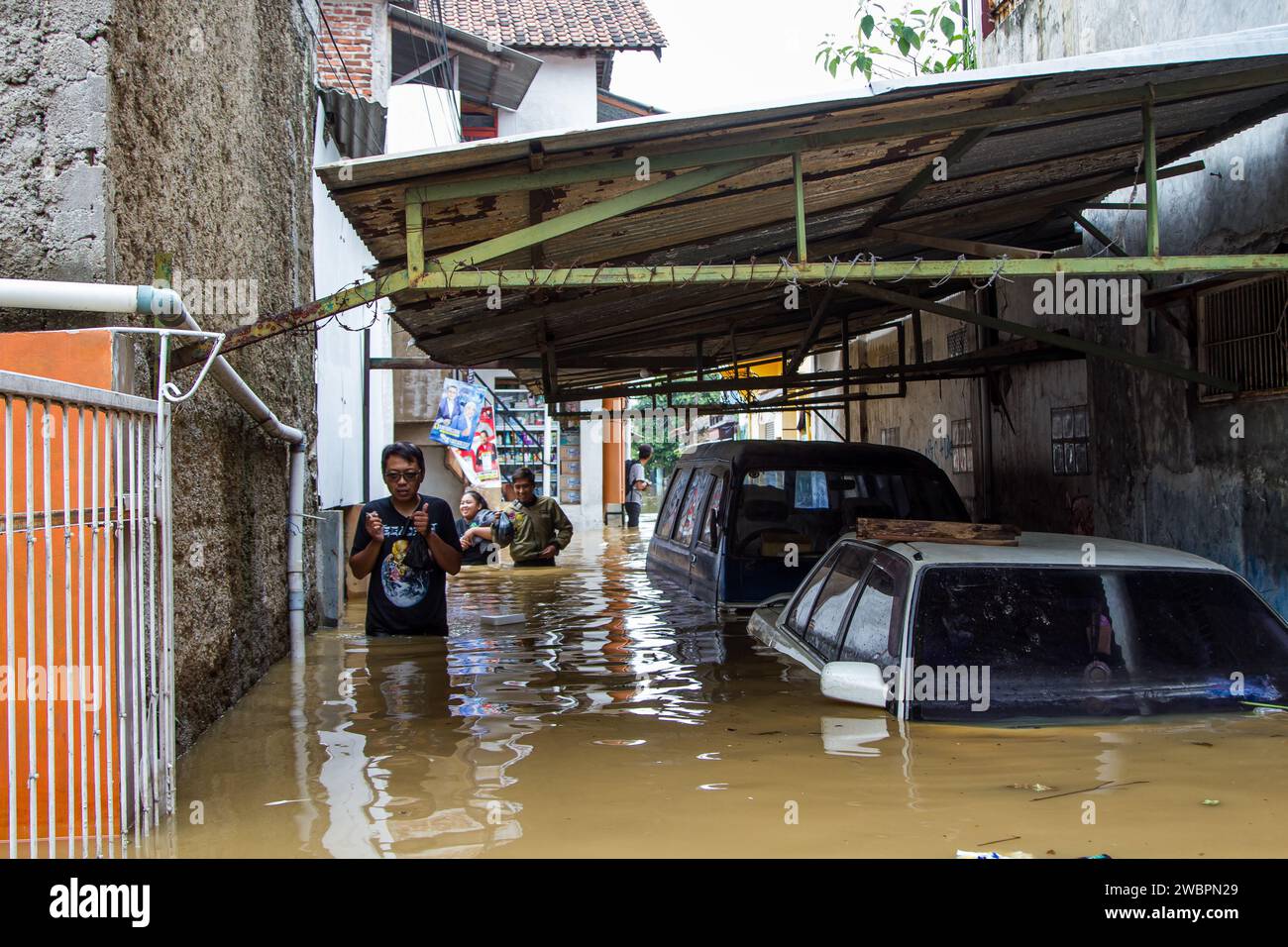 Bandung, West Java, Indonesia. 12th Jan, 2024. A man passing throught ...