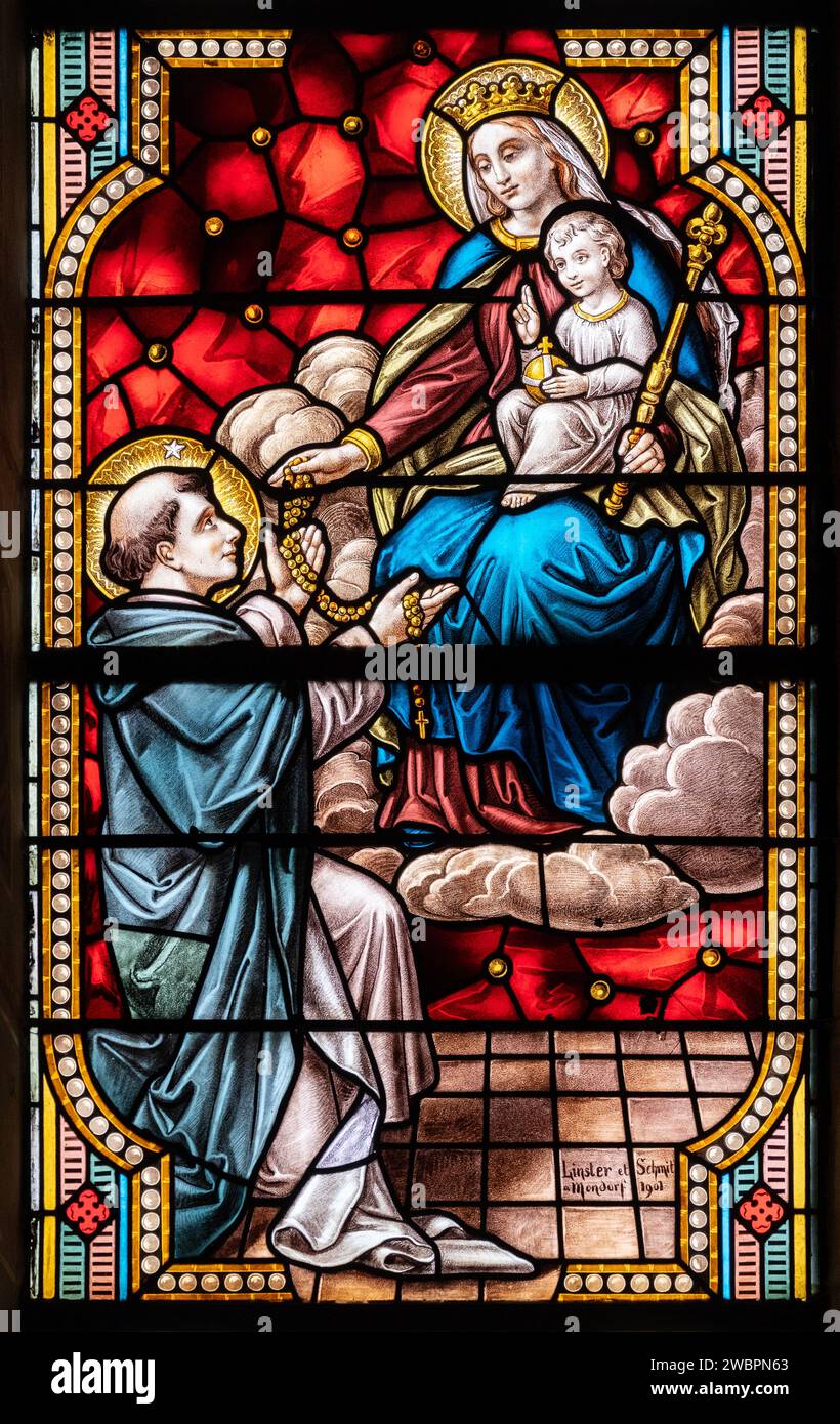 Saint Dominic receiving the rosary from the Virgin Mary. A stained ...