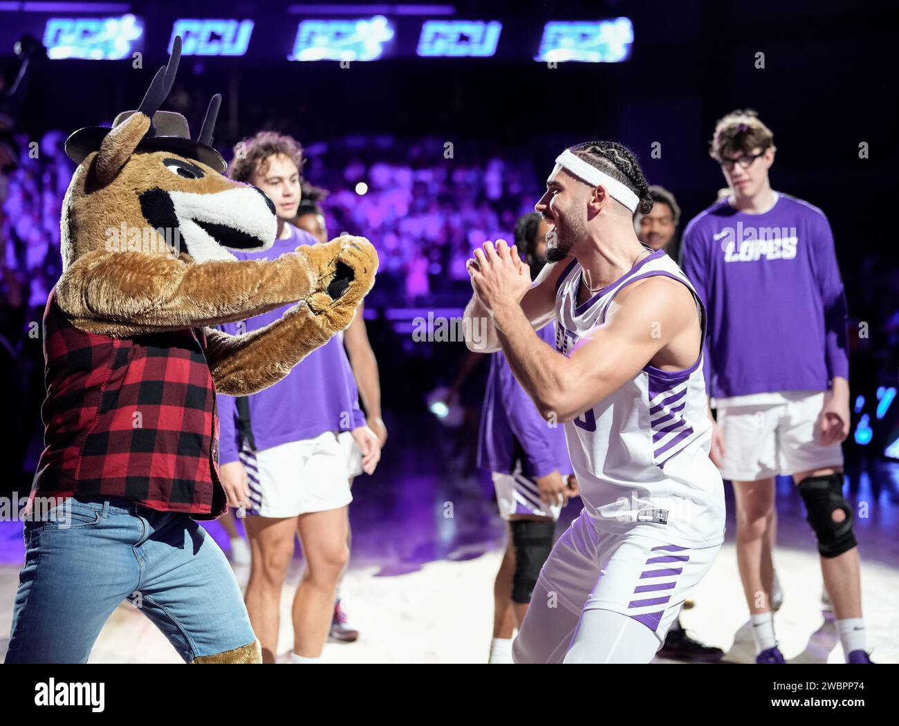 Grand Canyon Antelopes player does his handshake with the gcu mascot ...