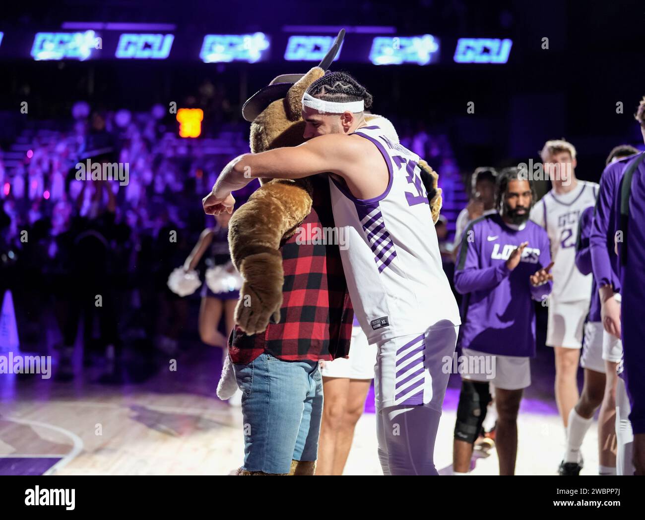 Grand Canyon Antelopes player does his handshake with the gcu mascot ...