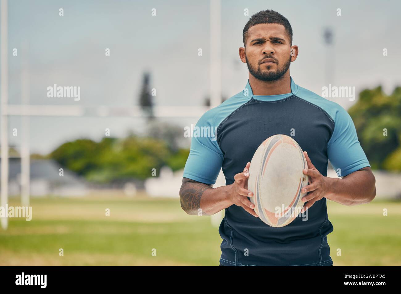 Rugby, field and portrait of man with ball, serious expression and ...
