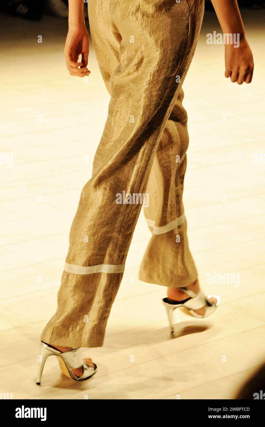 Model striding down the fashion runway in Gold pants, CHADDI by Chad ...