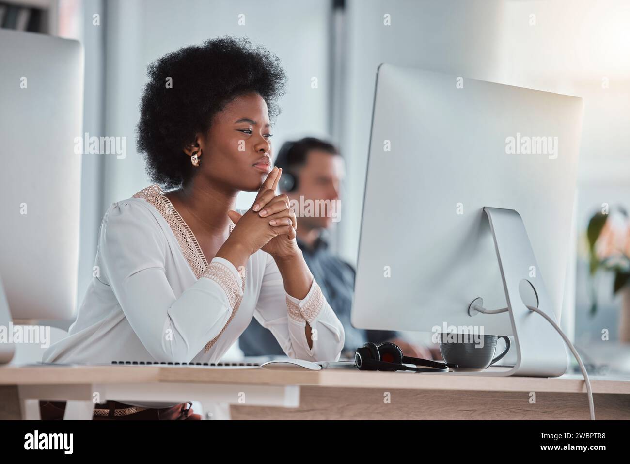 Thinking, focus or black woman on computer in office for online project ...