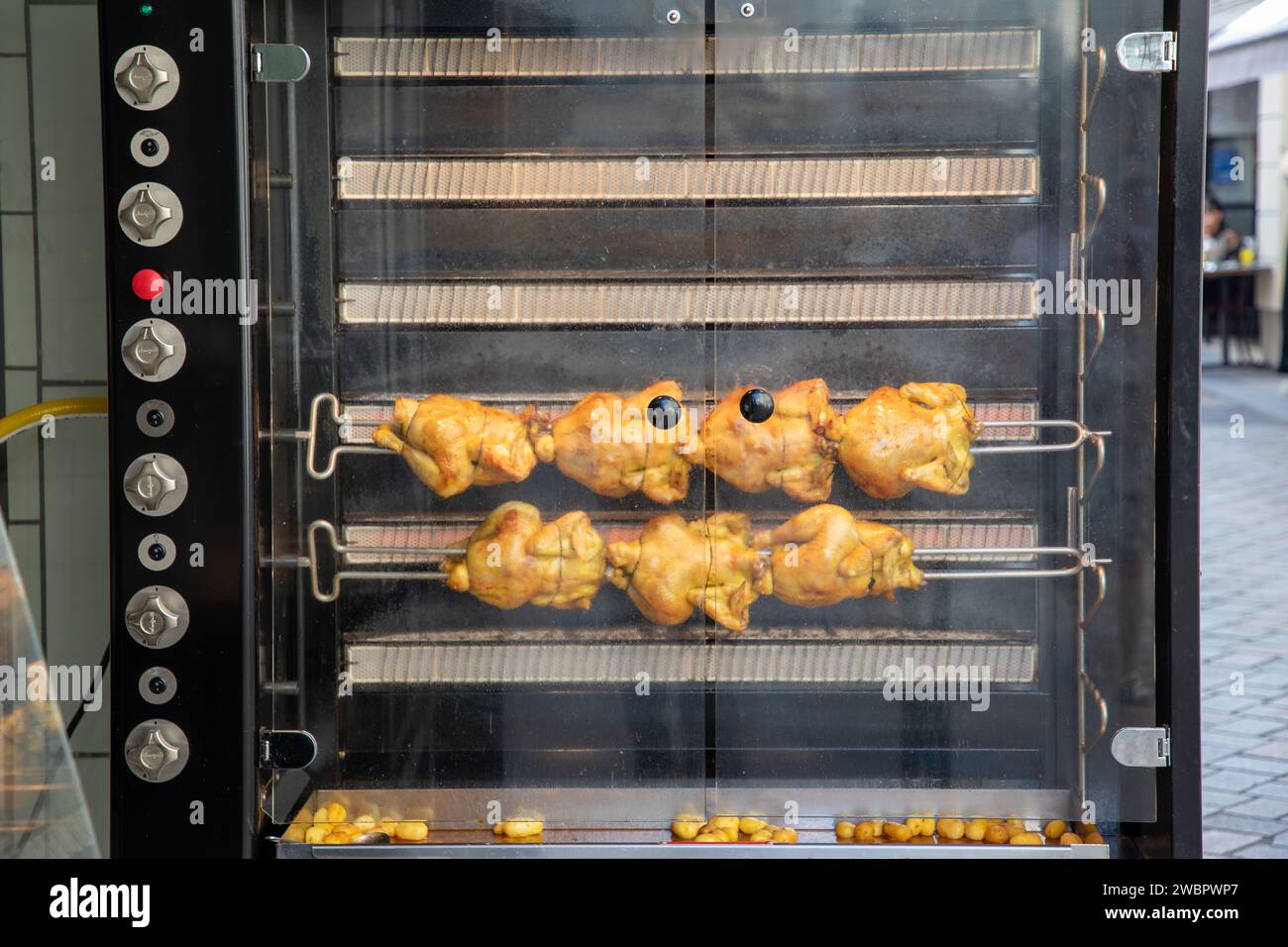 chicken on spit cook stack of grilled chicken on a skewer fried in ...
