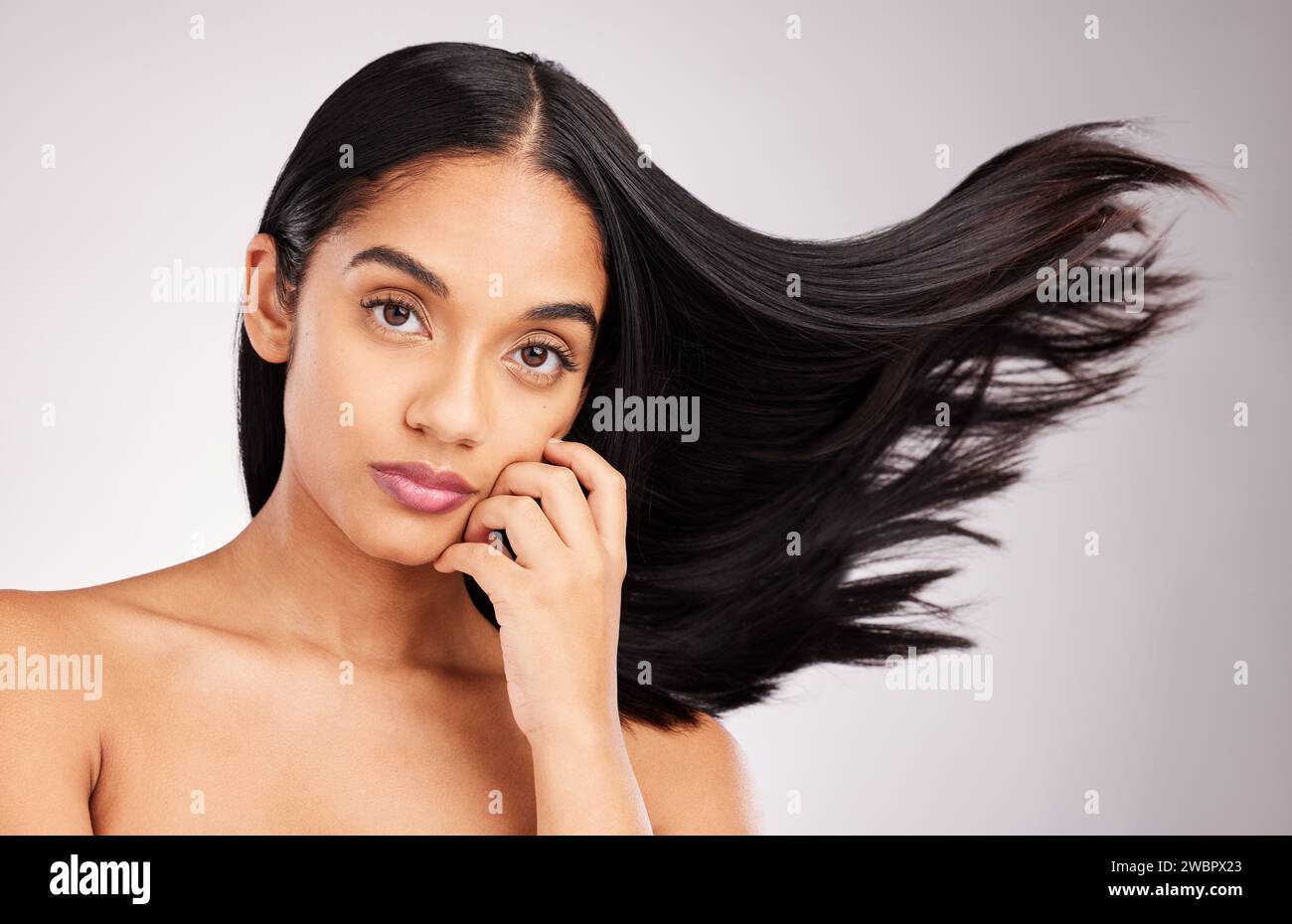 Hair flip, portrait and beauty of a woman in a isolated, white ...
