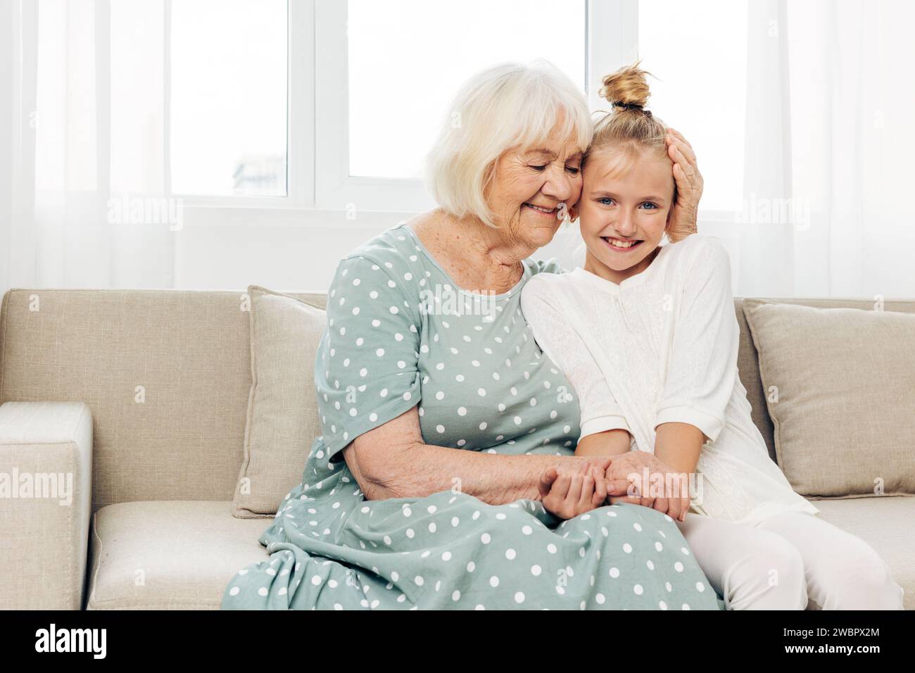 Couch woman grandmother sofa granddaughter child girl home happy love ...