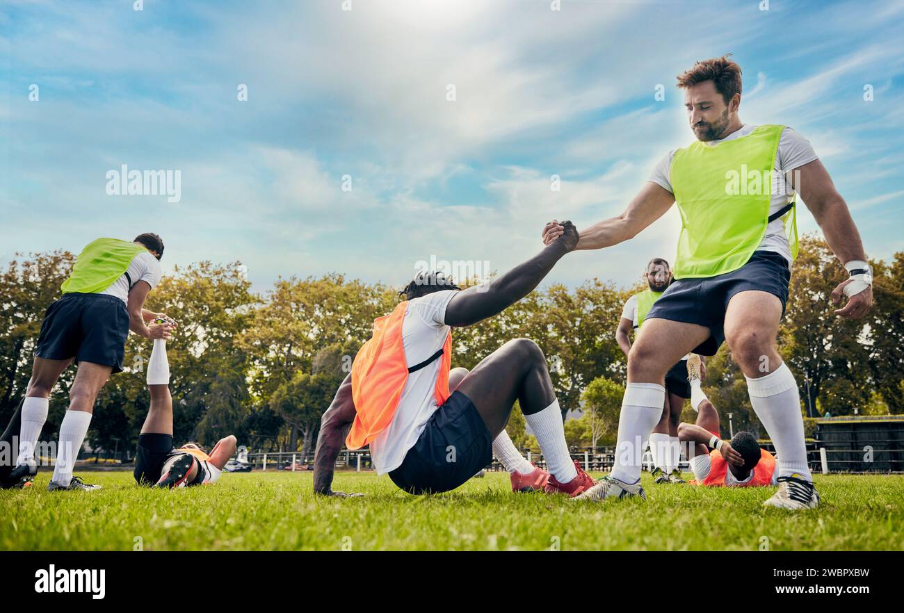 Teamwork, helping hand or rugby men in training, exercise or workout in ...
