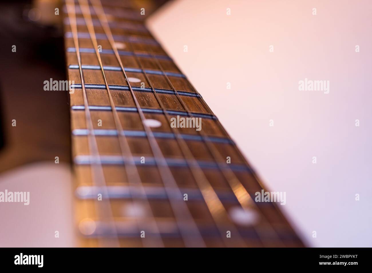 Soft musical background with guitar neck with strings Stock Photo - Alamy