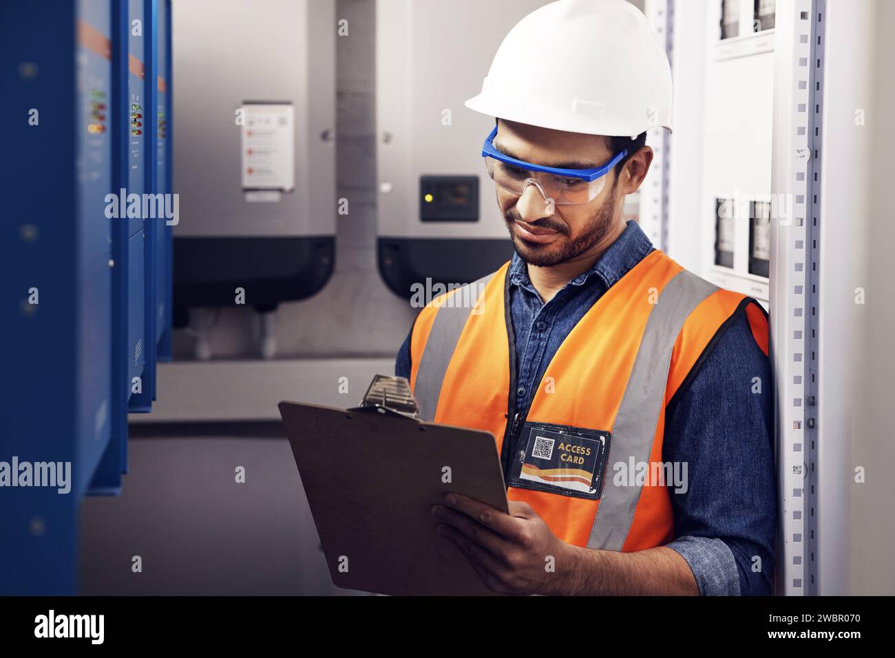 Electrician writing in electrical substation hi-res stock photography ...