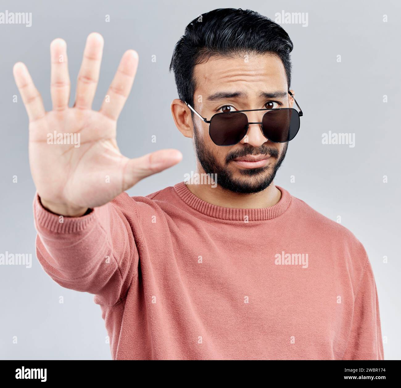Stop, portrait and a cool man with sunglasses isolated on a white ...
