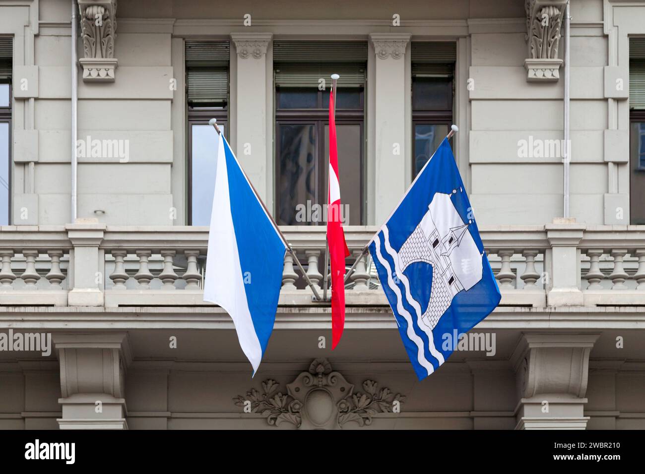 Flags of Zurich and Switzerland above a building entrance in the city ...