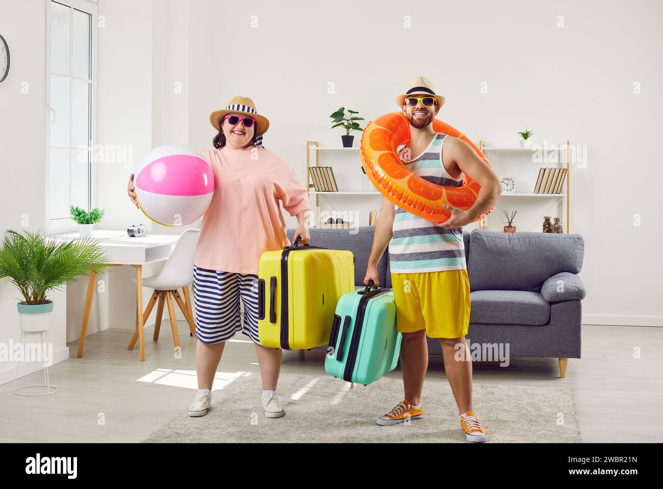 Funny happy family couple get ready for vacation trip Stock Photo - Alamy