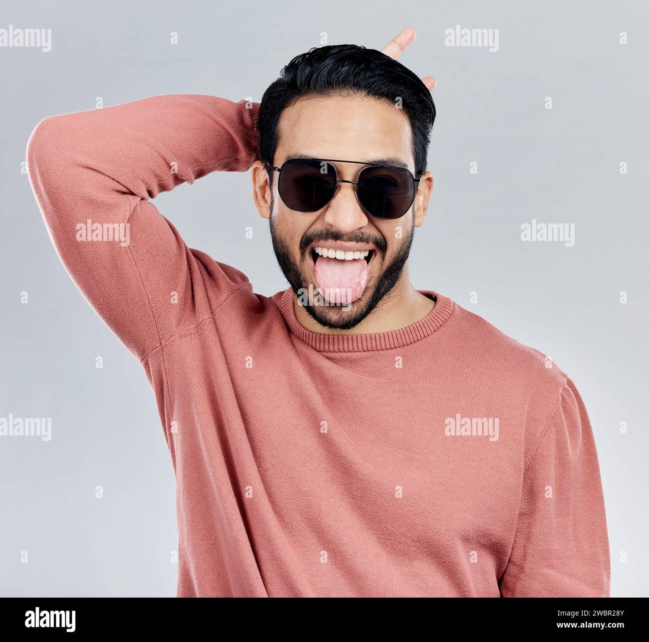 Portrait, tongue out and Asian man with sunglasses, funny and silly ...