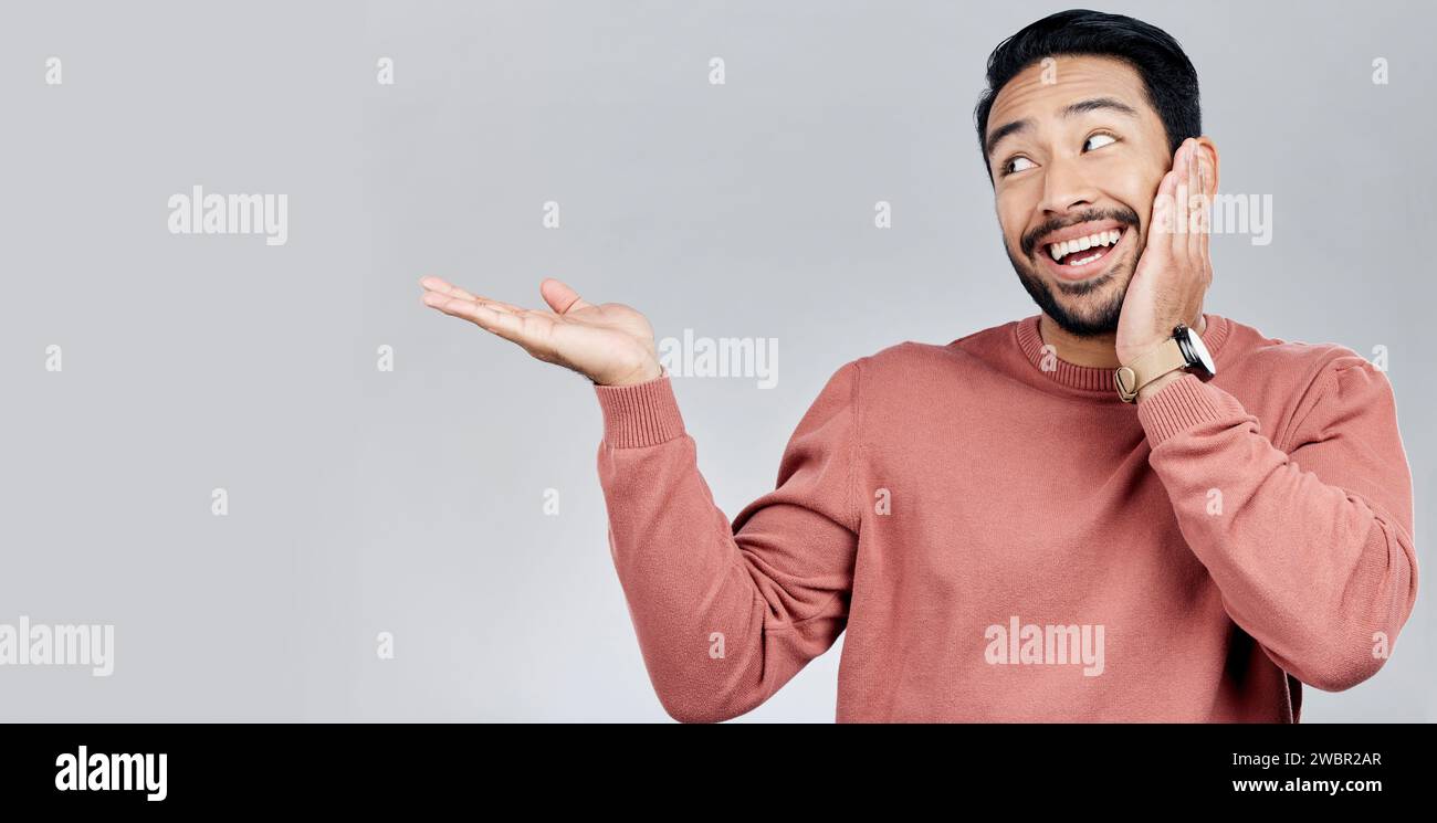 Product placement, happy and an Asian man showing mockup isolated on a ...