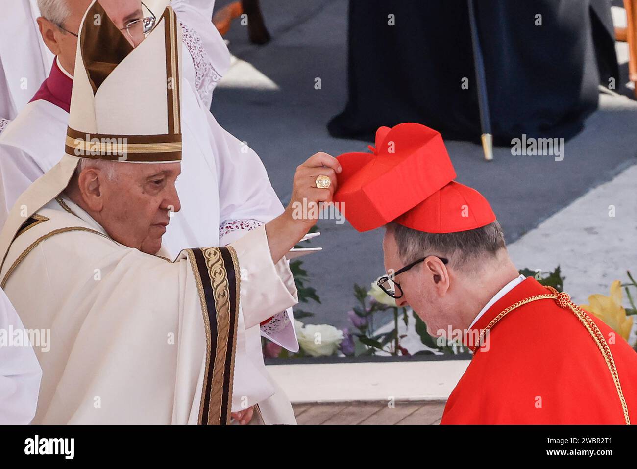 Pope Francis puts the red biretta on the head of new cardinal Claudio ...