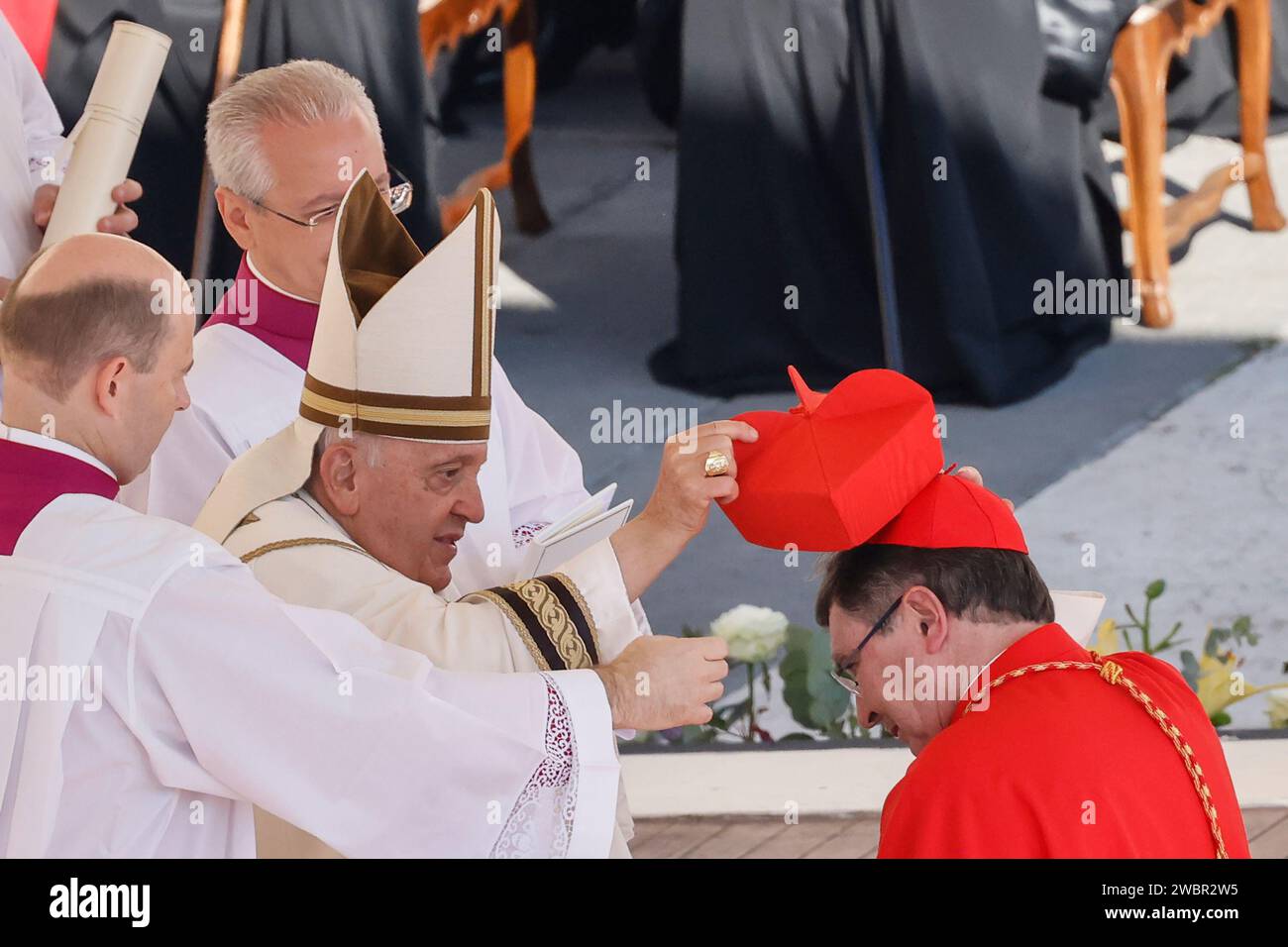 Pope Francis puts the red biretta on the head of new cardinal ...