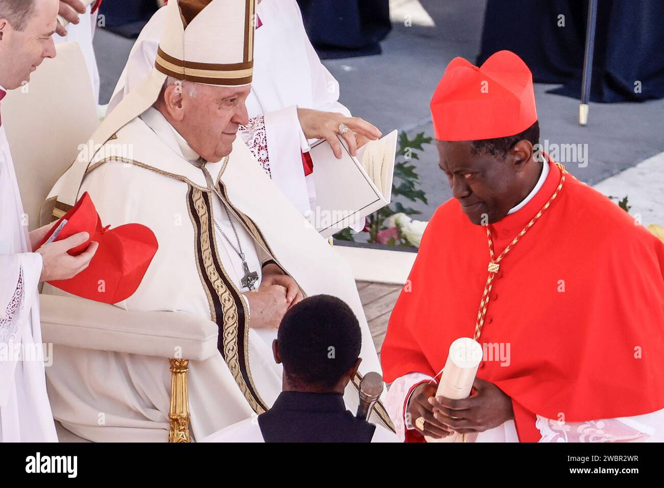 New cardinal Protase Rugambwa walks past Pope Francis during a ...