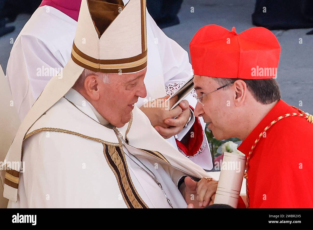 Pope Francis greets new cardinal Americo Manuel Alves Aguiar during a ...