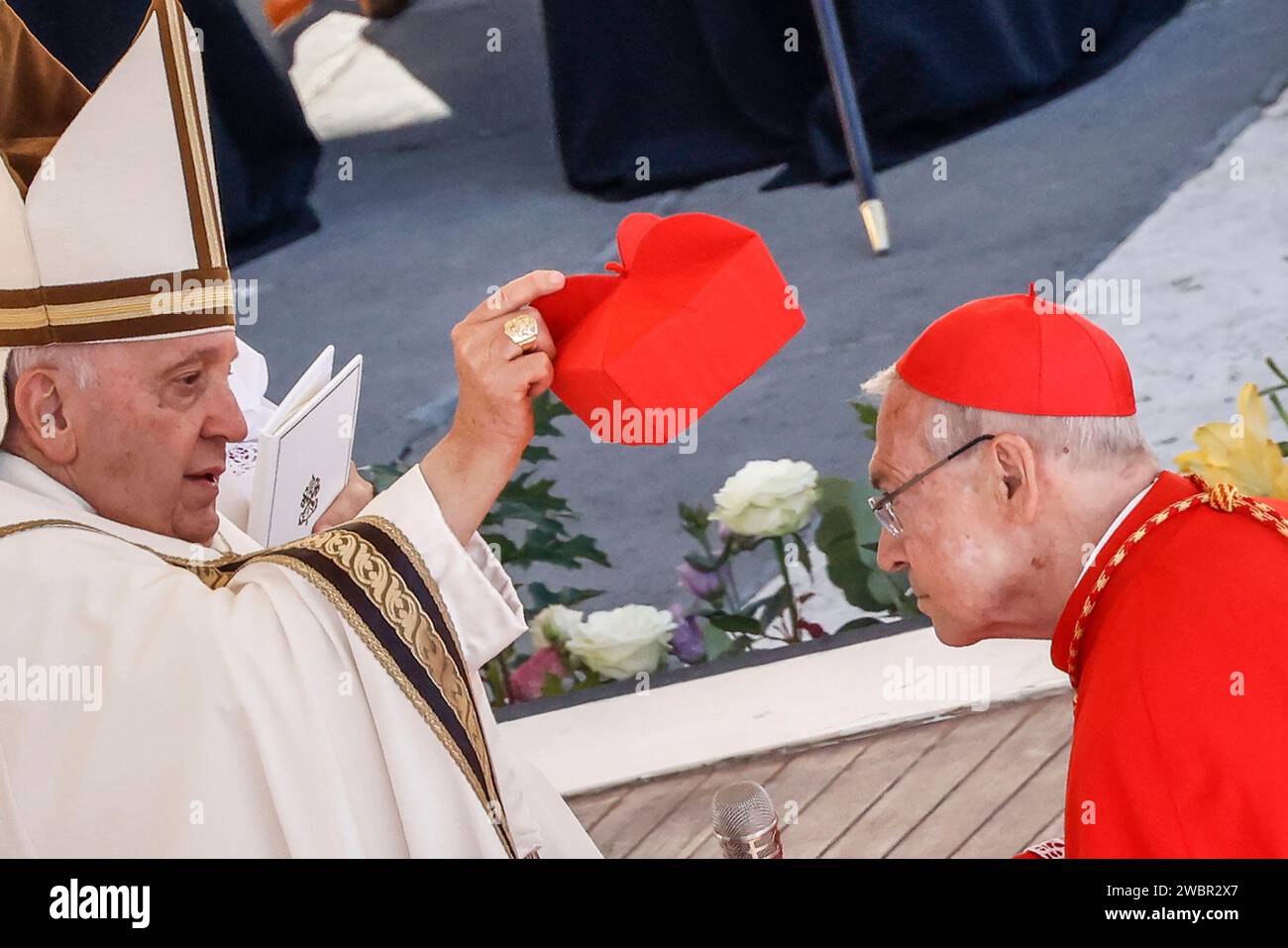 Pope Francis puts the red biretta on the head of new cardinal Agostino ...