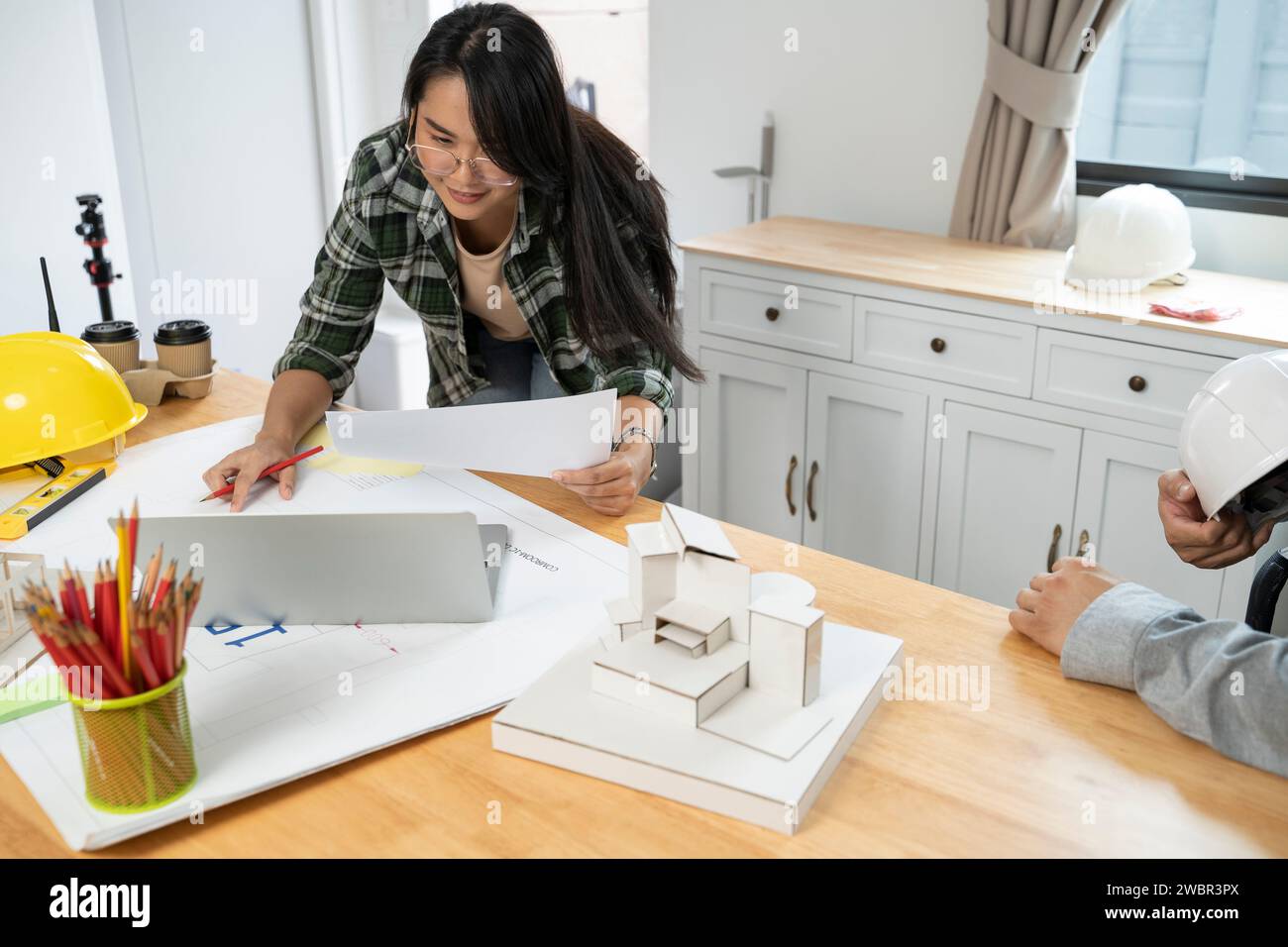 young female engineer making blueprints Stock Photo - Alamy
