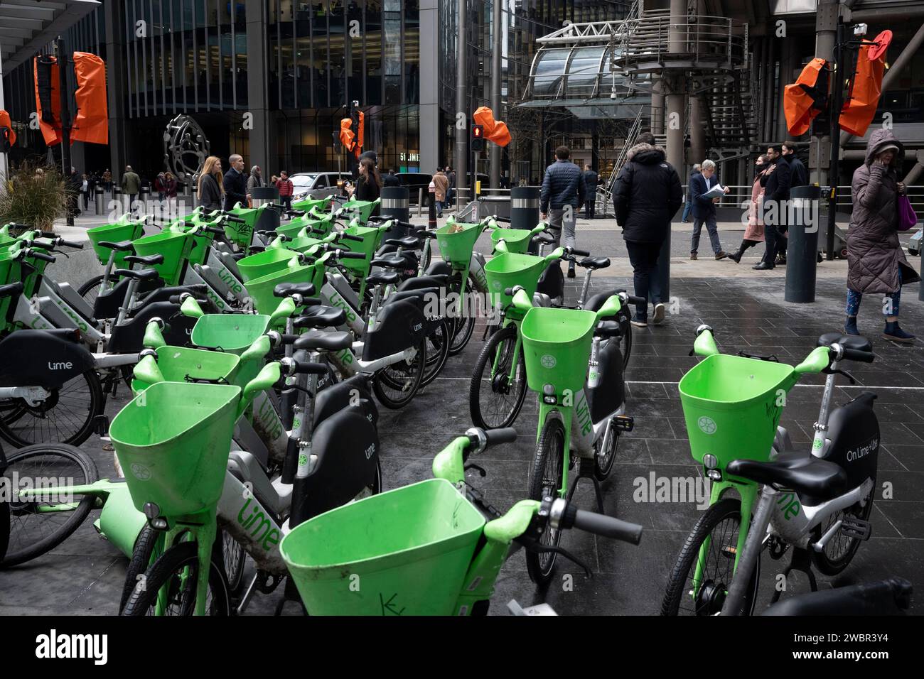 Lots of Lime rental eBikes are parked together on Leadenhall in the ...