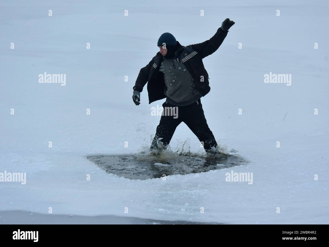 VINNYTSIA, UKRAINE - JANUARY 11, 2024 - A rescue diver imitates someone ...