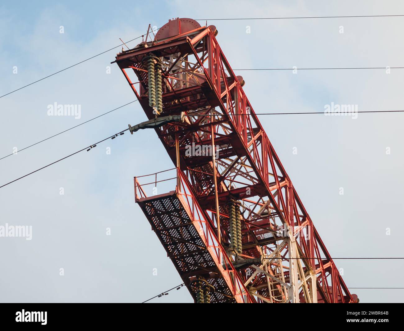 Fragment of a huge power transmission line mast with wires and ...