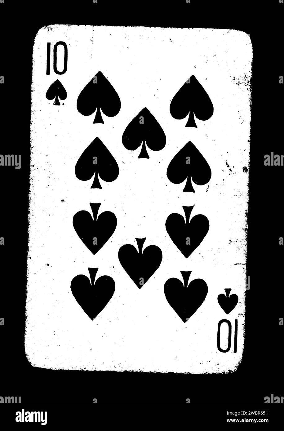 A vintage ten of spades playing card isolated on a black background ...