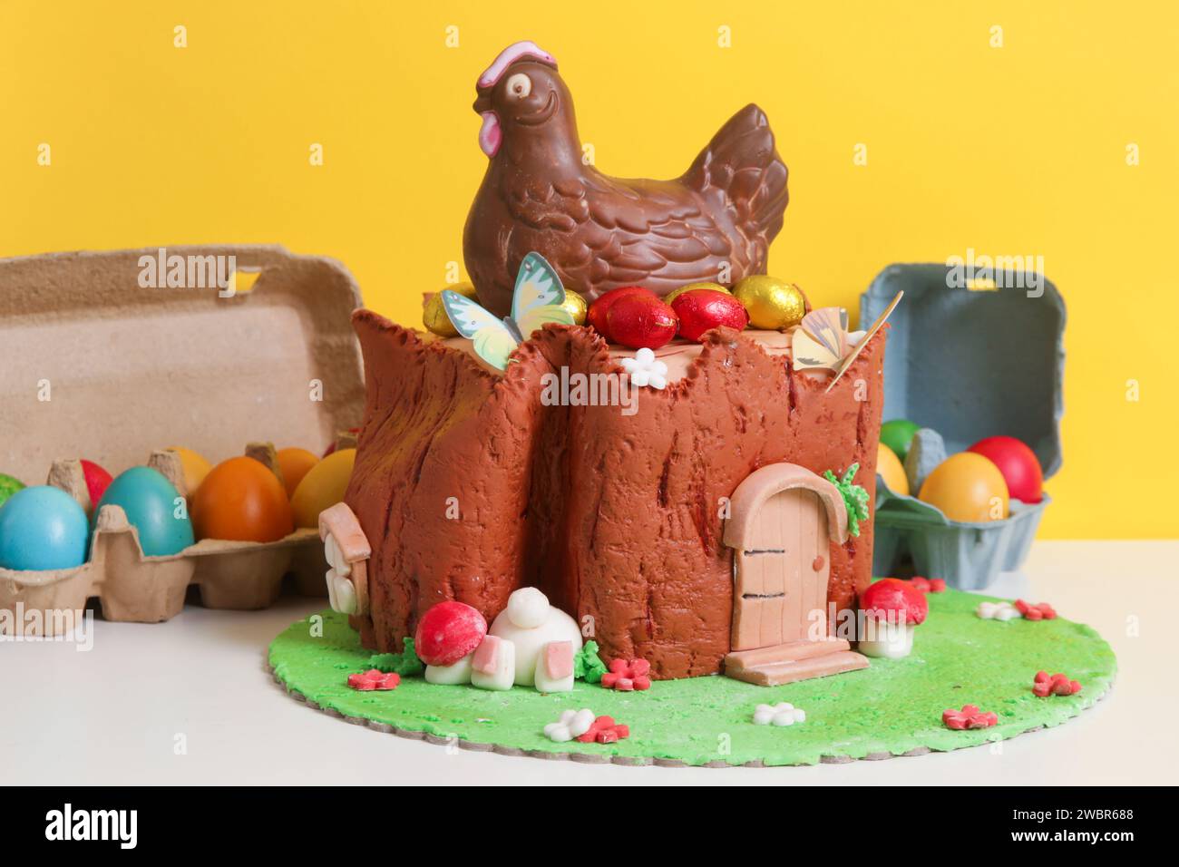Easter log cake with textured look on the tree trunk and Easter bunny ...