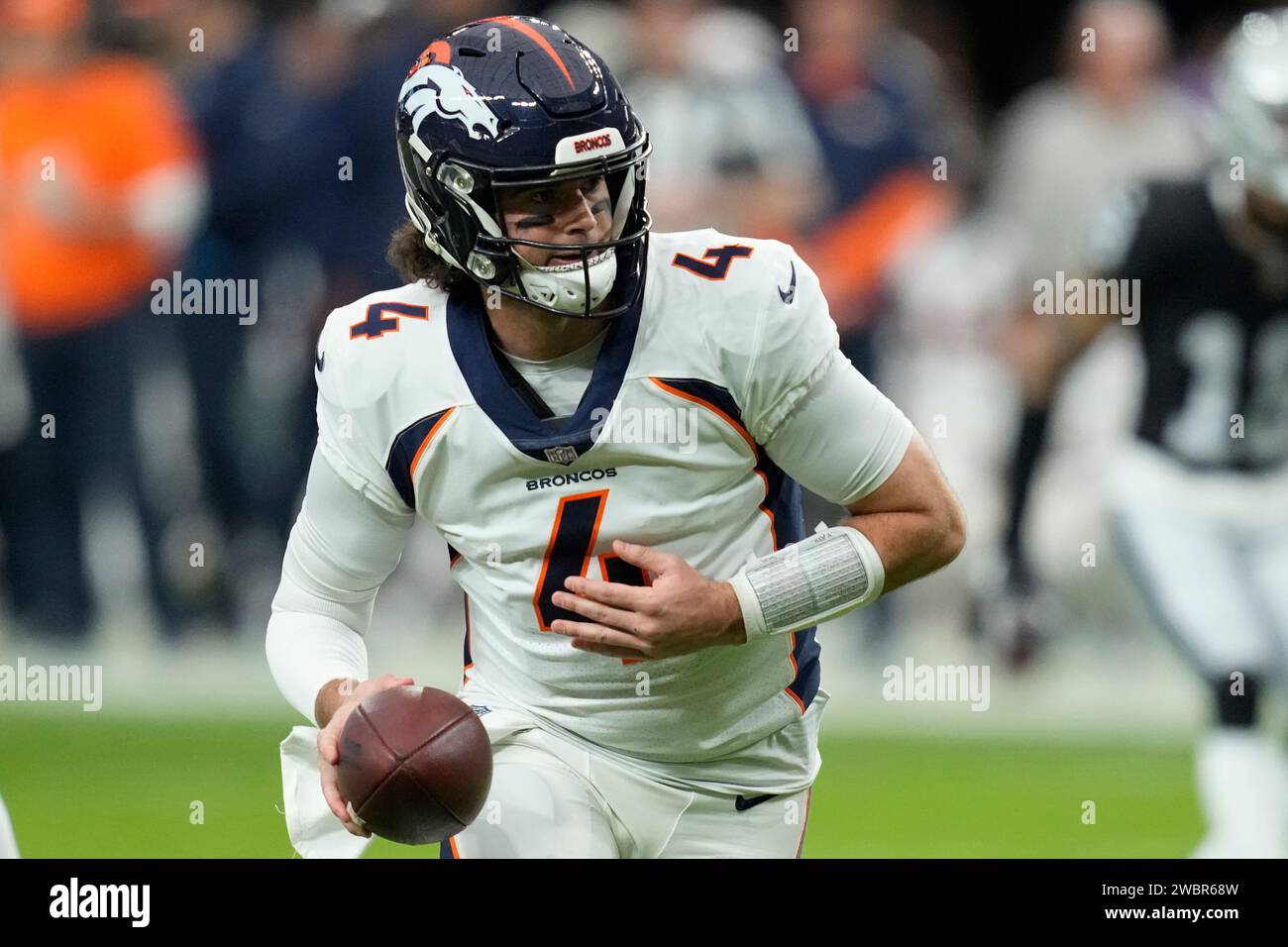 Denver Broncos quarterback Jarrett Stidham (4) plays against the Las Vegas Raiders during an NFL ...