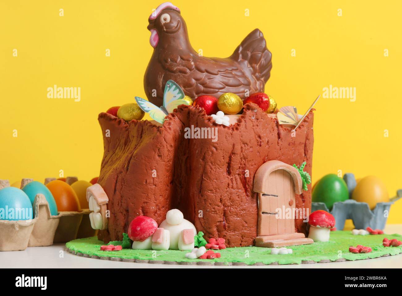 Easter log cake with textured look on the tree trunk and Easter bunny ...