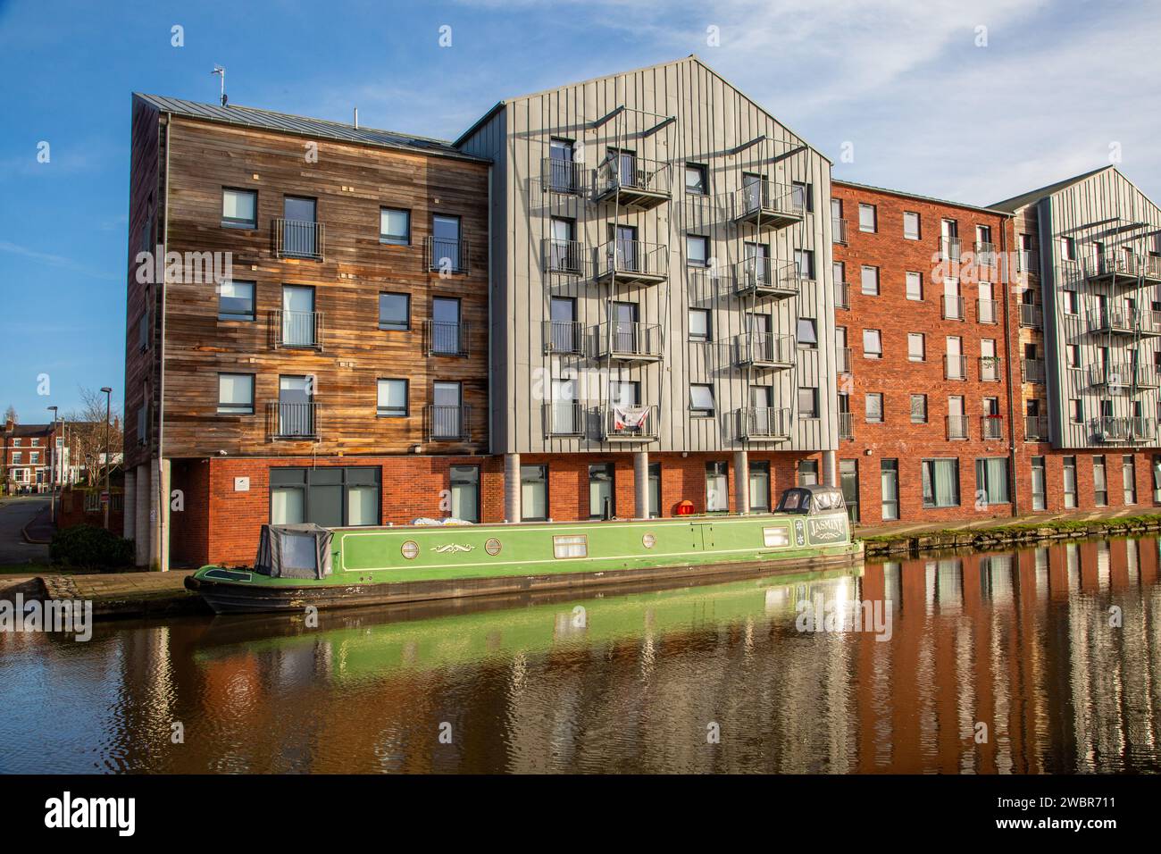 Narrowboat moored alongside waterside apartments on the Shropshire ...