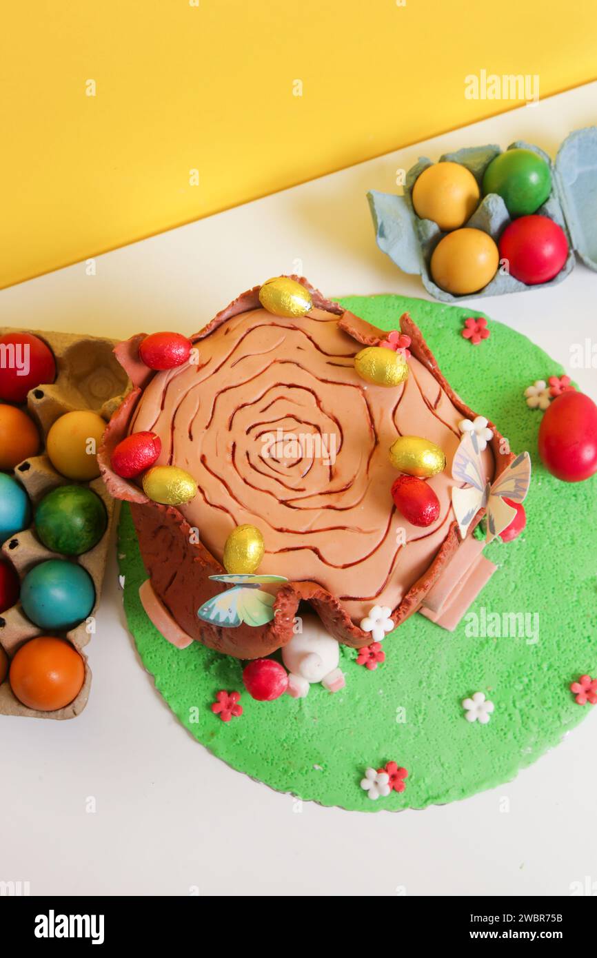 Easter log cake with textured look on the tree trunk and Easter bunny ...