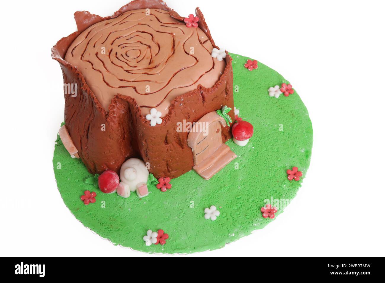 Easter log cake with textured look on the tree trunk and Easter bunny ...
