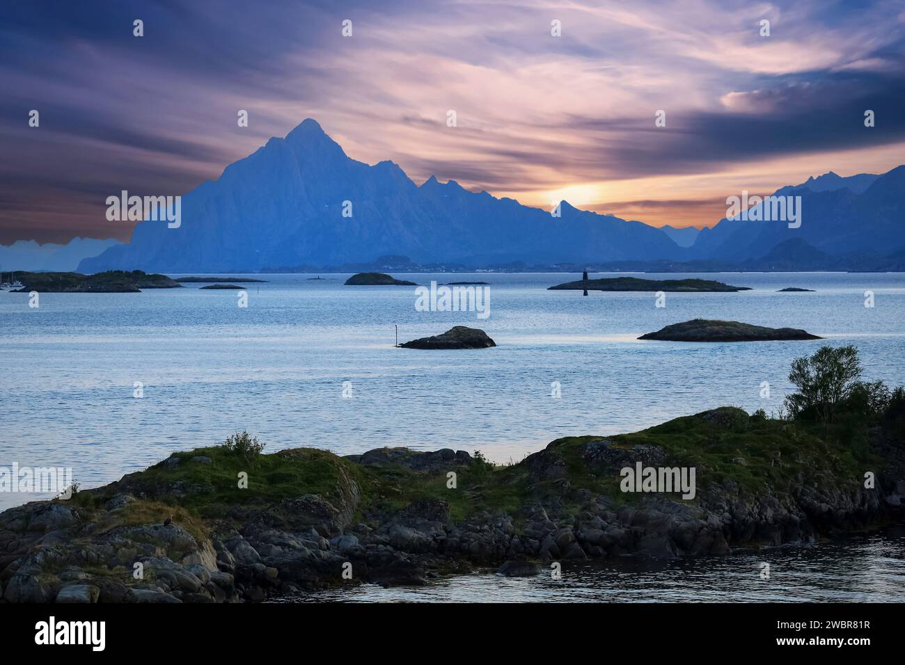 Midsummer sun on the sky in the fjord Vestfjorden near the Lofoten ...