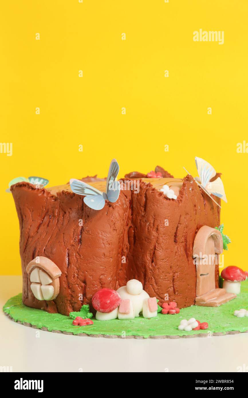Easter log cake with textured look on the tree trunk and Easter bunny ...