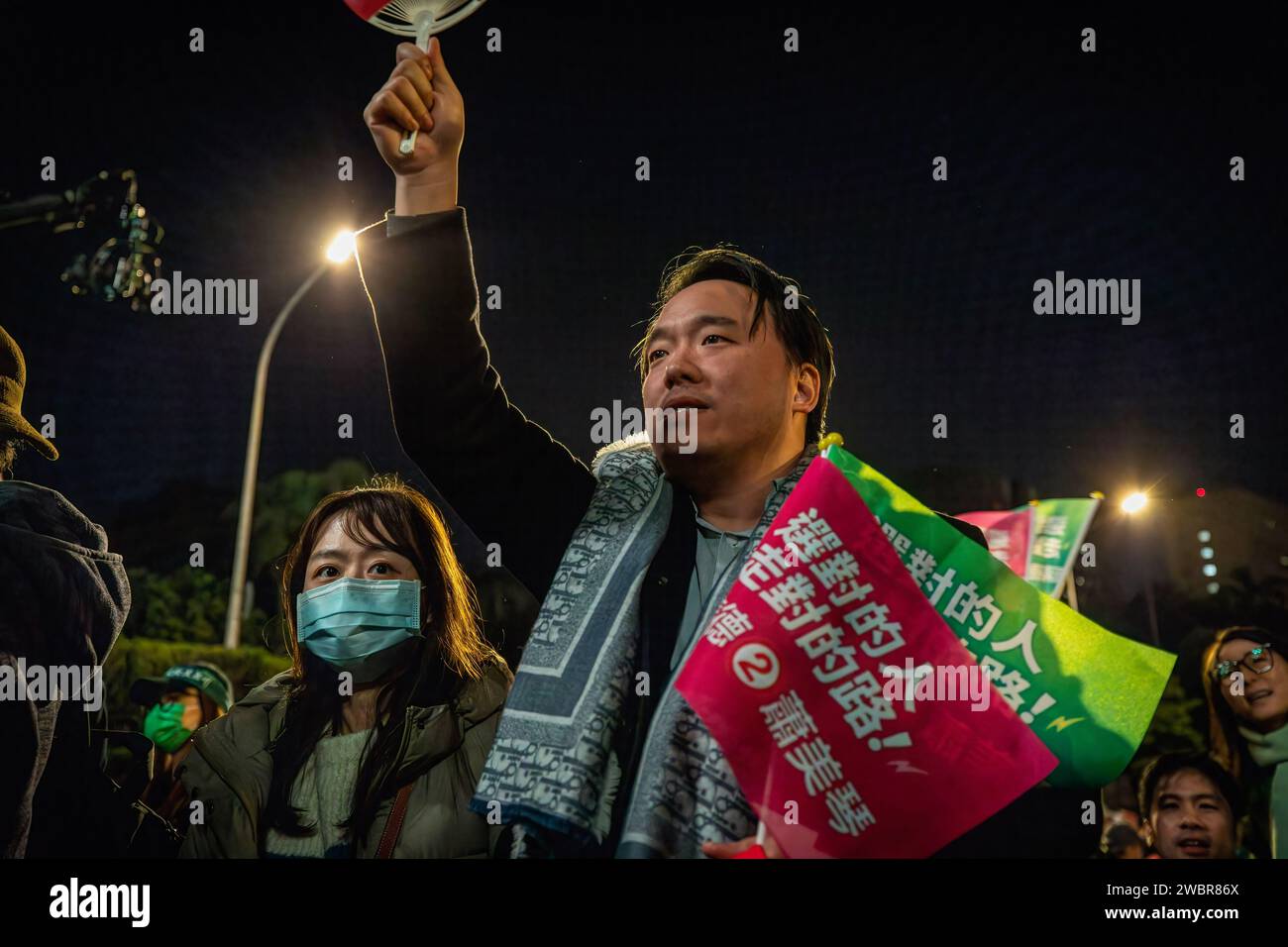 Taipei, Taiwan. 11th Jan, 2024. A supporter waves their flags during ...